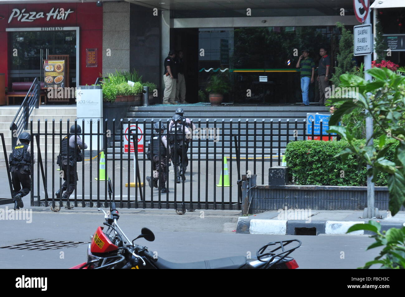 Police officers take security measures near the location of explosions ...