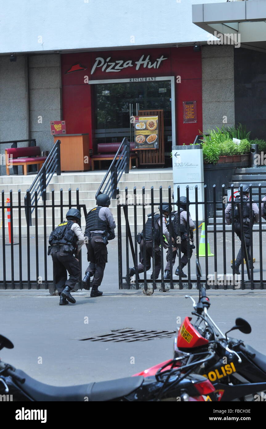 Police officers take security measures near the location of explosions ...