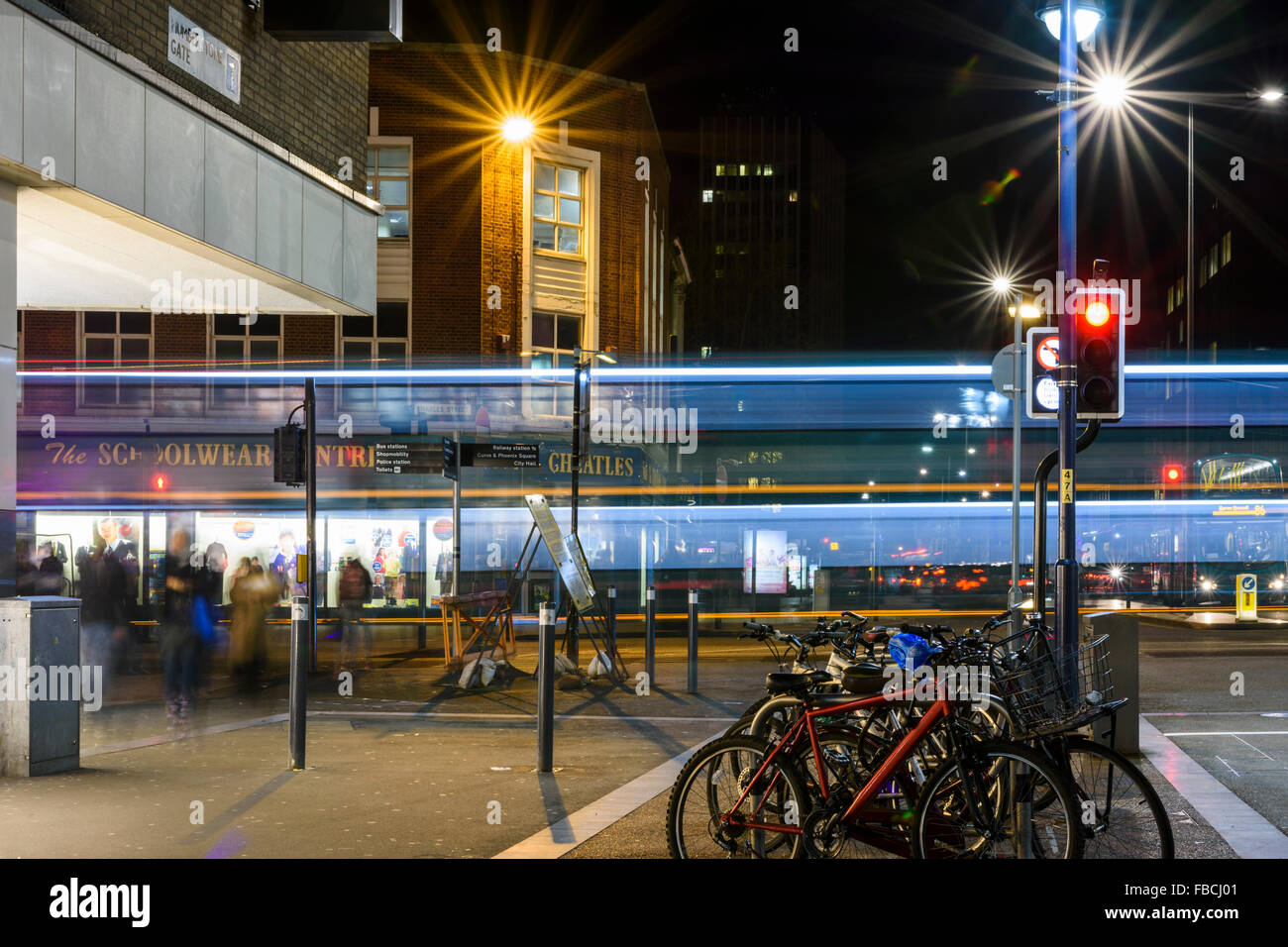 Light trail at night from a passing bus on Charles Street in Leicester ...