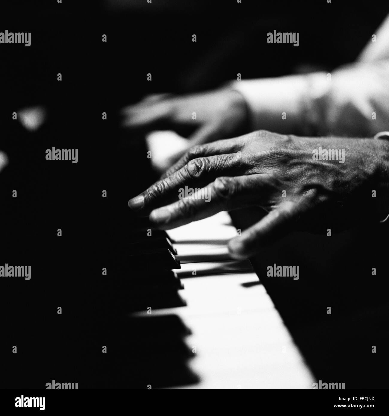 Hands on piano keys Stock Photo - Alamy