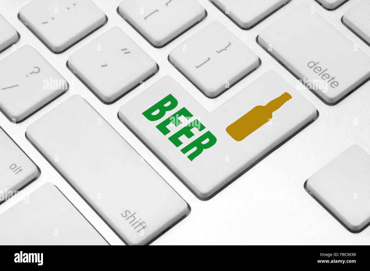 Beer time on the computer keyboard Stock Photo - Alamy