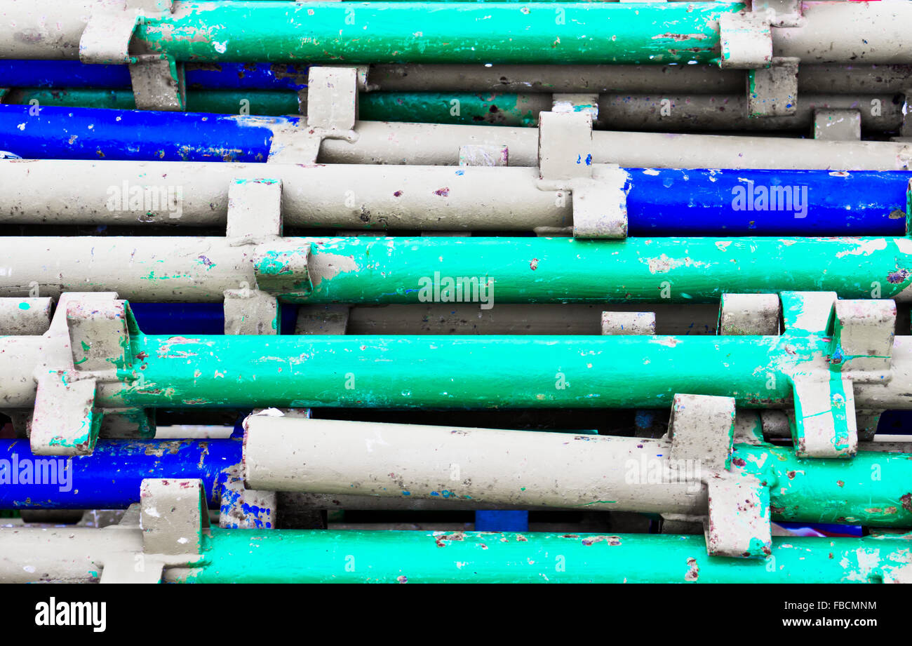 Old scaffolding bars painted blue and truquoise, as a background Stock ...