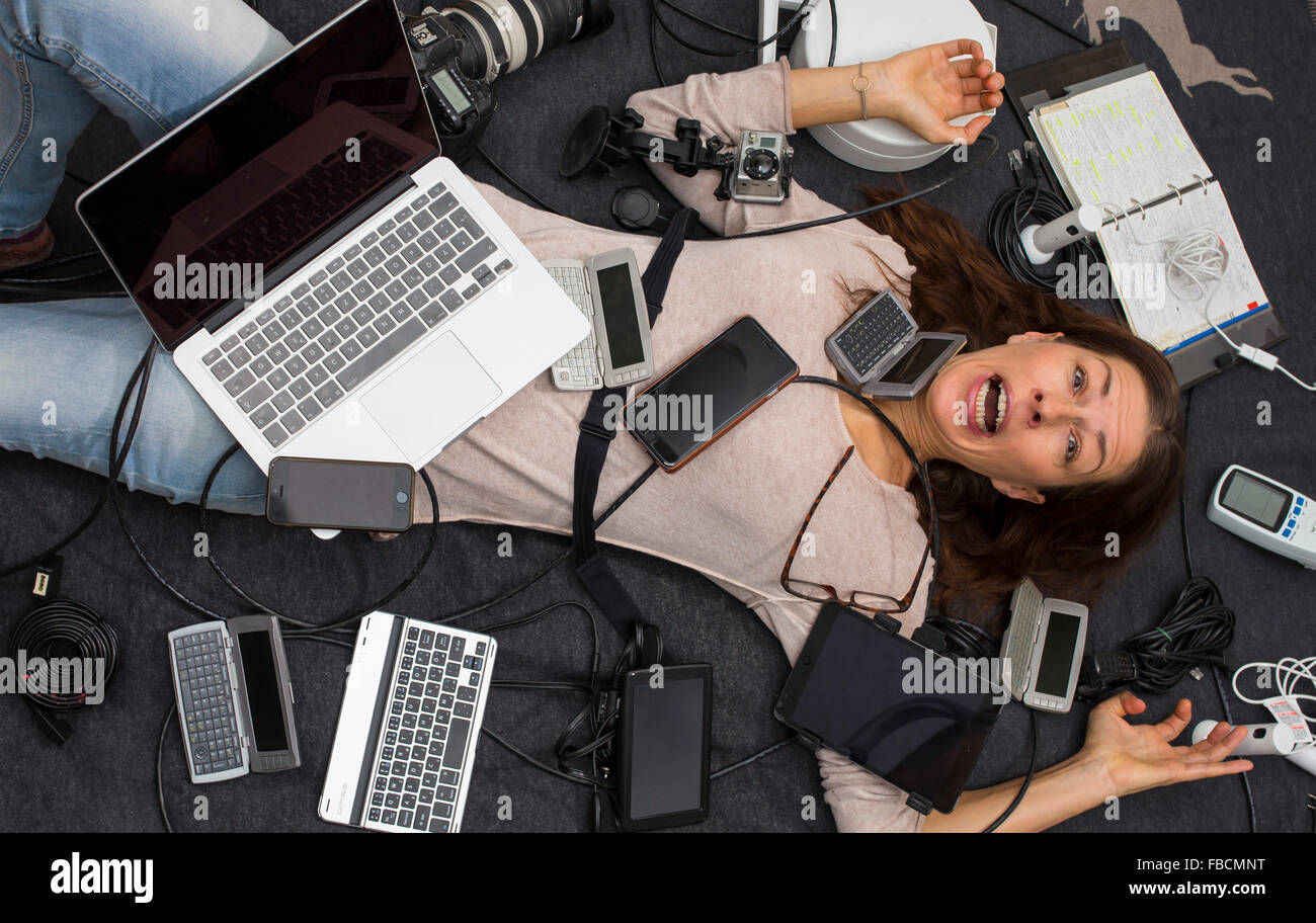 business woman surrounded by technology telecommunications, mobile ...