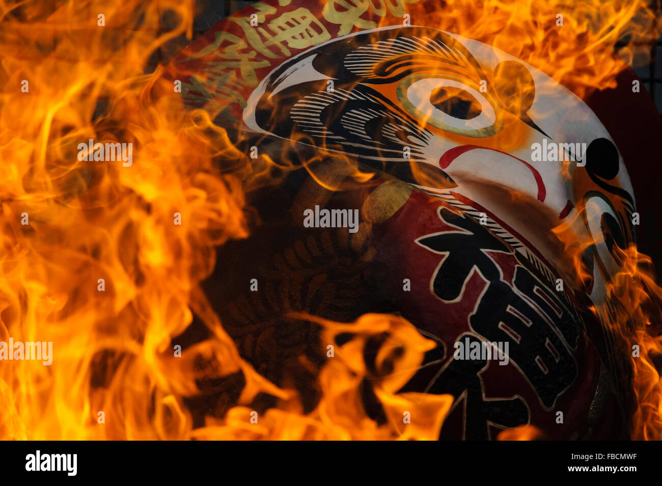 Nagoya, Japan. 14th January, 2016. A Daruma doll burns in a fire at ...
