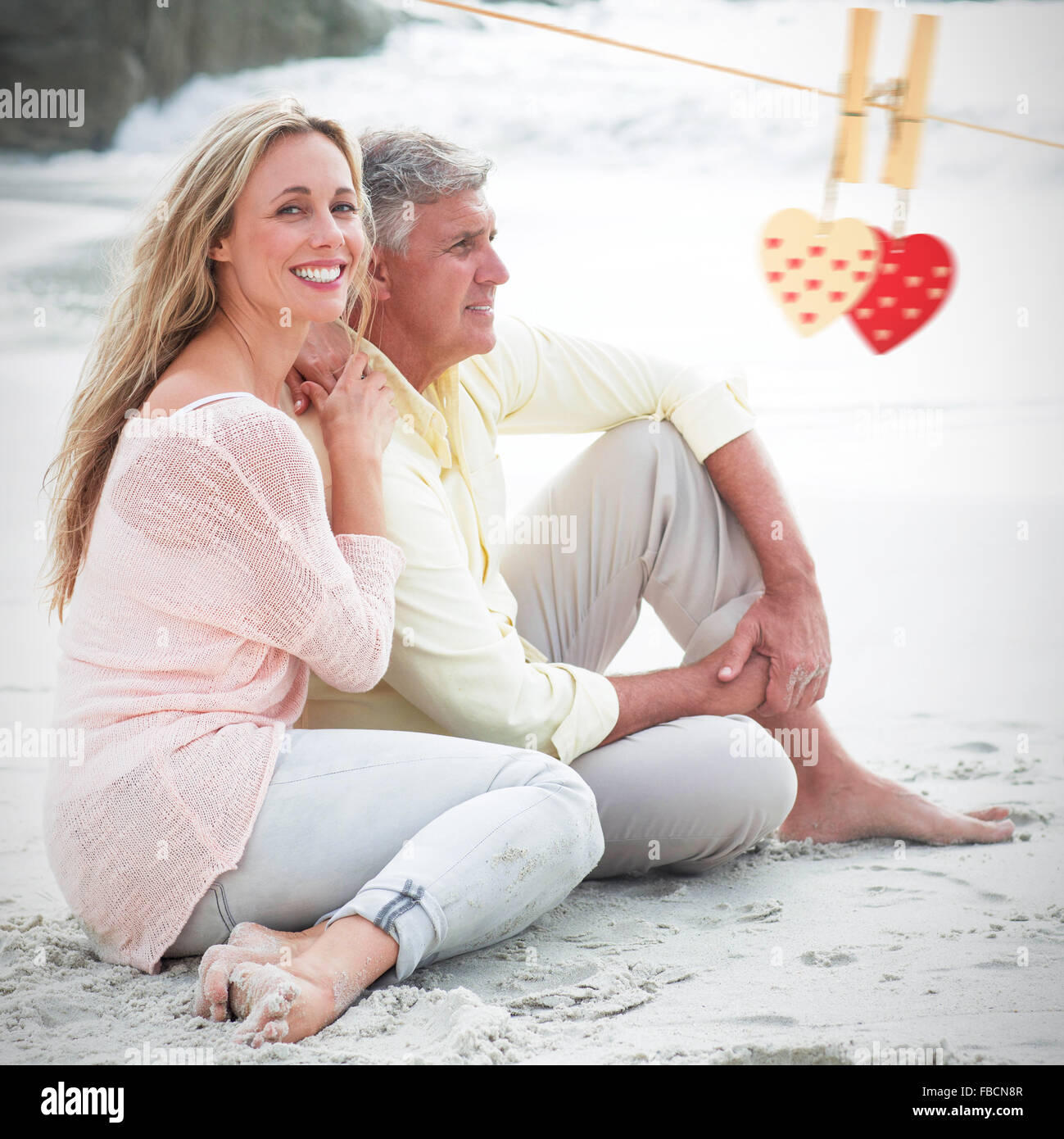 Couple sitting on beach embracing hi-res stock photography and images ...