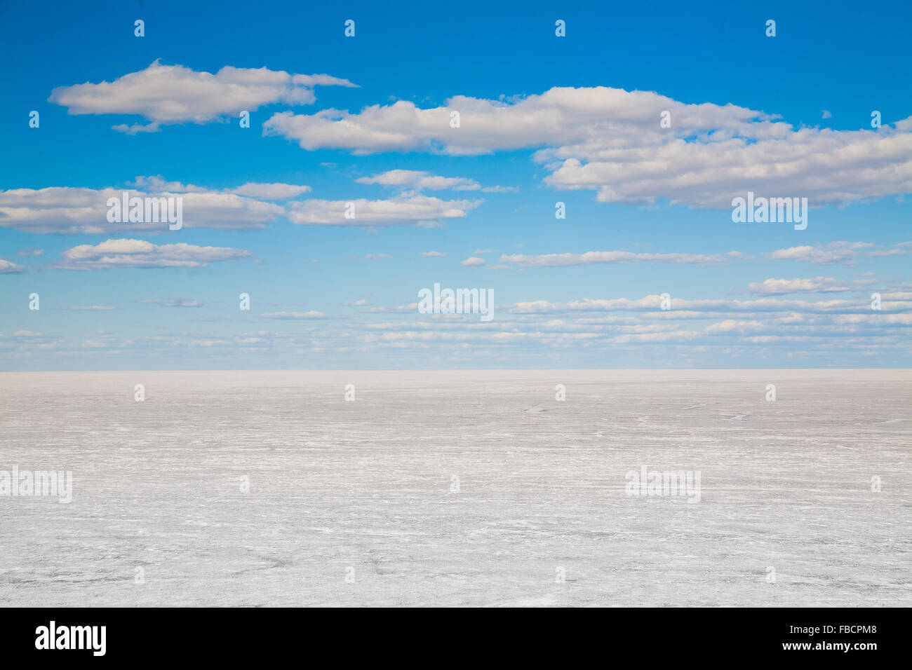 Frozen lake and blue sky with clouds Stock Photo - Alamy