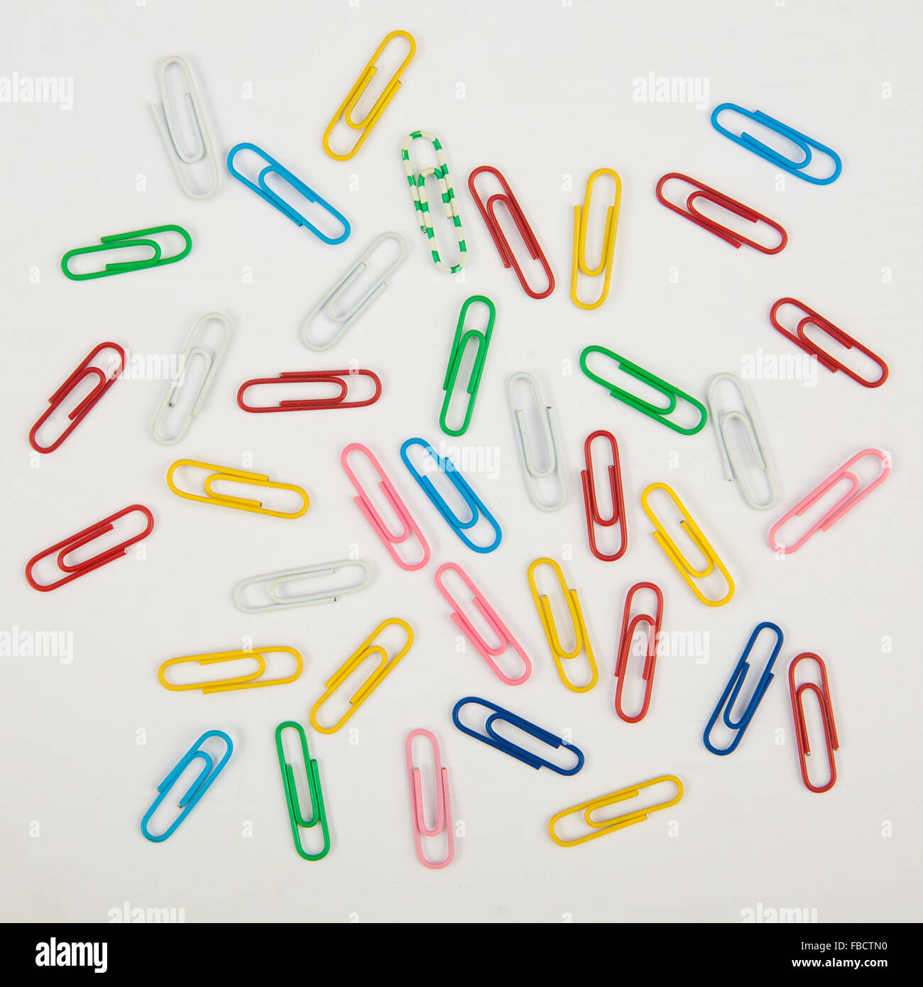Paper clips on a white background Stock Photo - Alamy