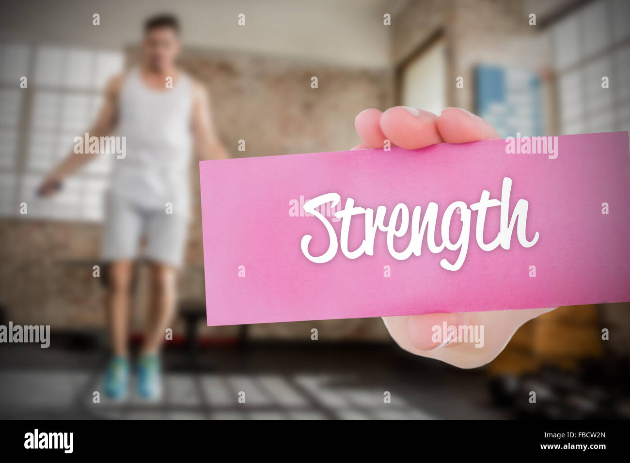 Strength against people background Stock Photo - Alamy