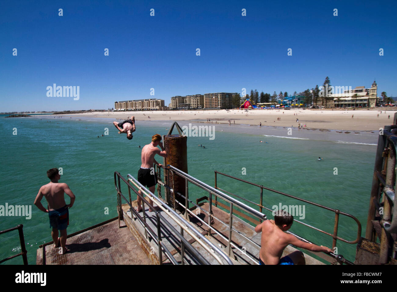 Adelaide Australia. 15th January 2016. People jump off Glenelg jetty to ...