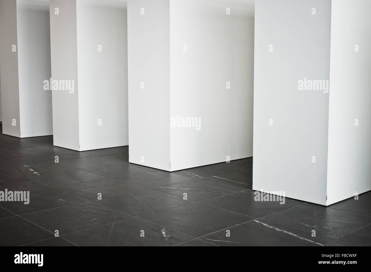 A row of white pillars inside a modern building (unidentifiable Stock ...