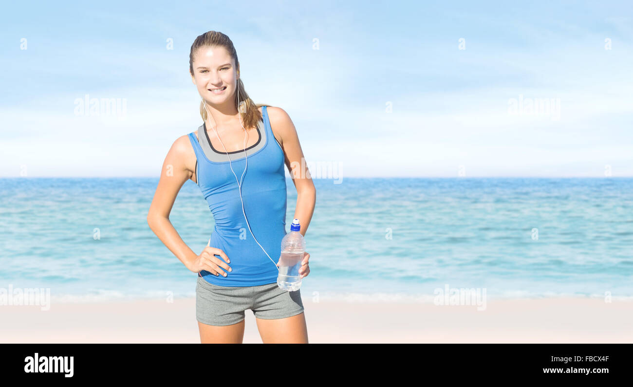 Composite image of fit woman with water Stock Photo - Alamy