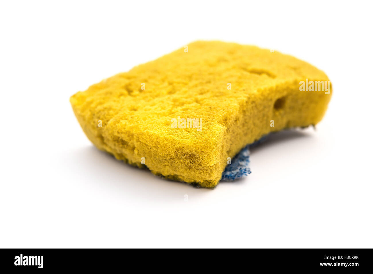 used double-side cleaning sponge on a white background Stock Photo - Alamy