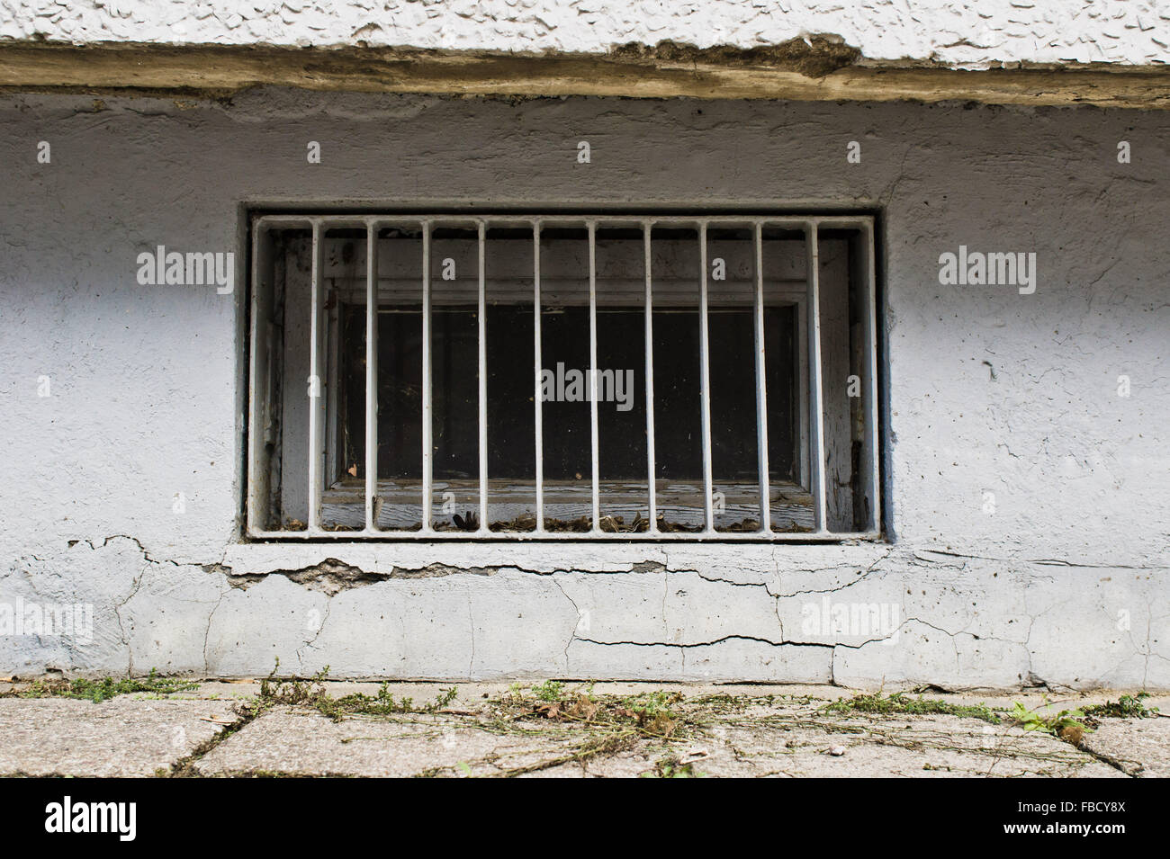 Bars on a small window above a cellar Stock Photo - Alamy