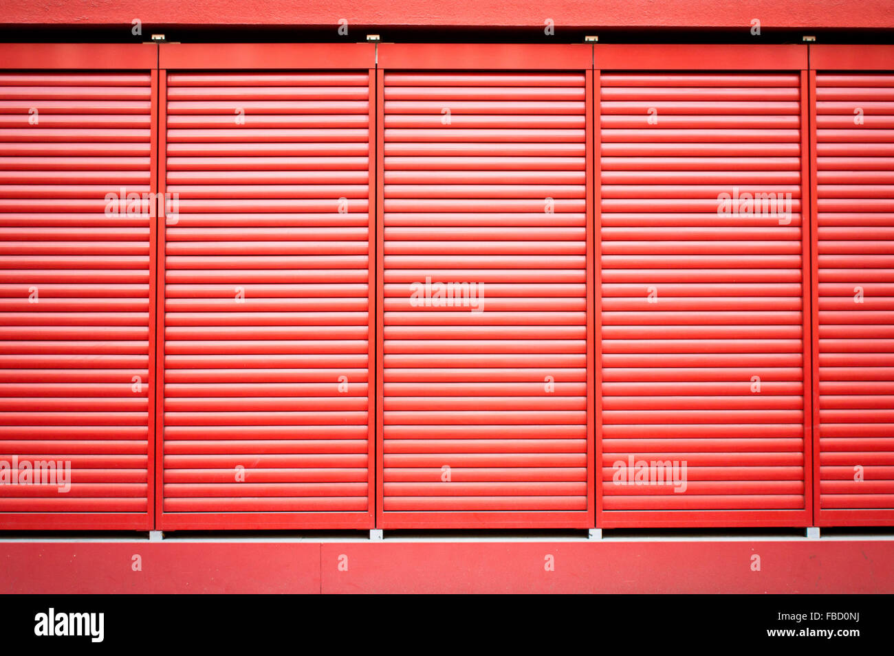 Red metal wall panels as a background image Stock Photo - Alamy