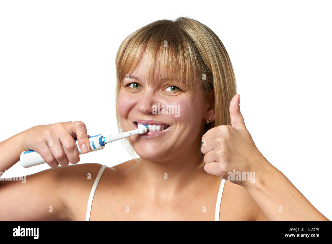 Happy woman brushing teeth and thumbs up sign ok isolated on white ...