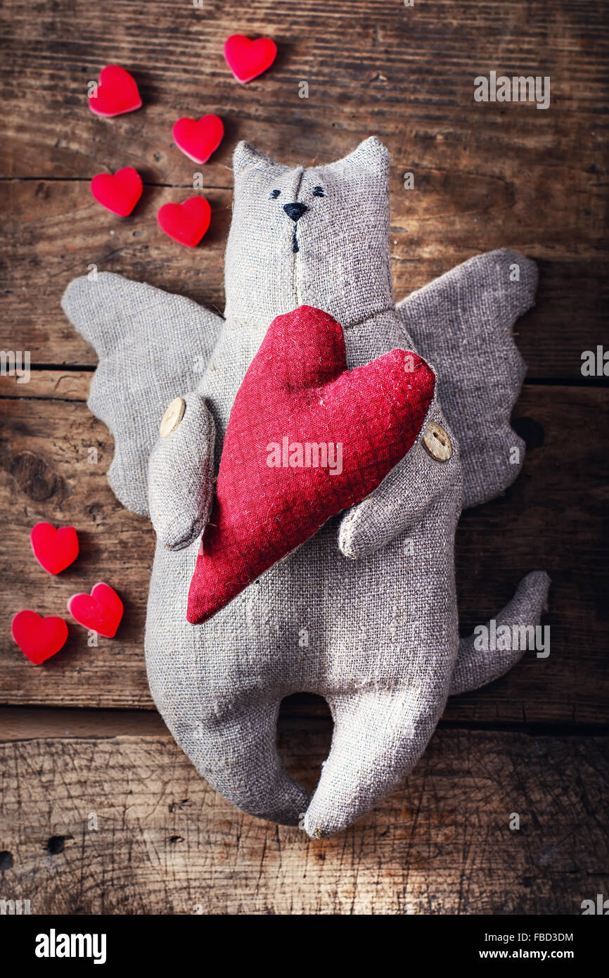 Hand-made,stuffed toy cat with wings.The symbol of Valentine's Day ...