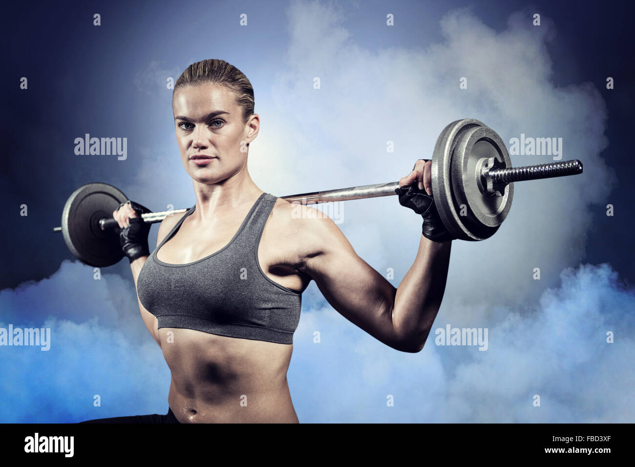 Young woman lifting barbell hi-res stock photography and images - Alamy