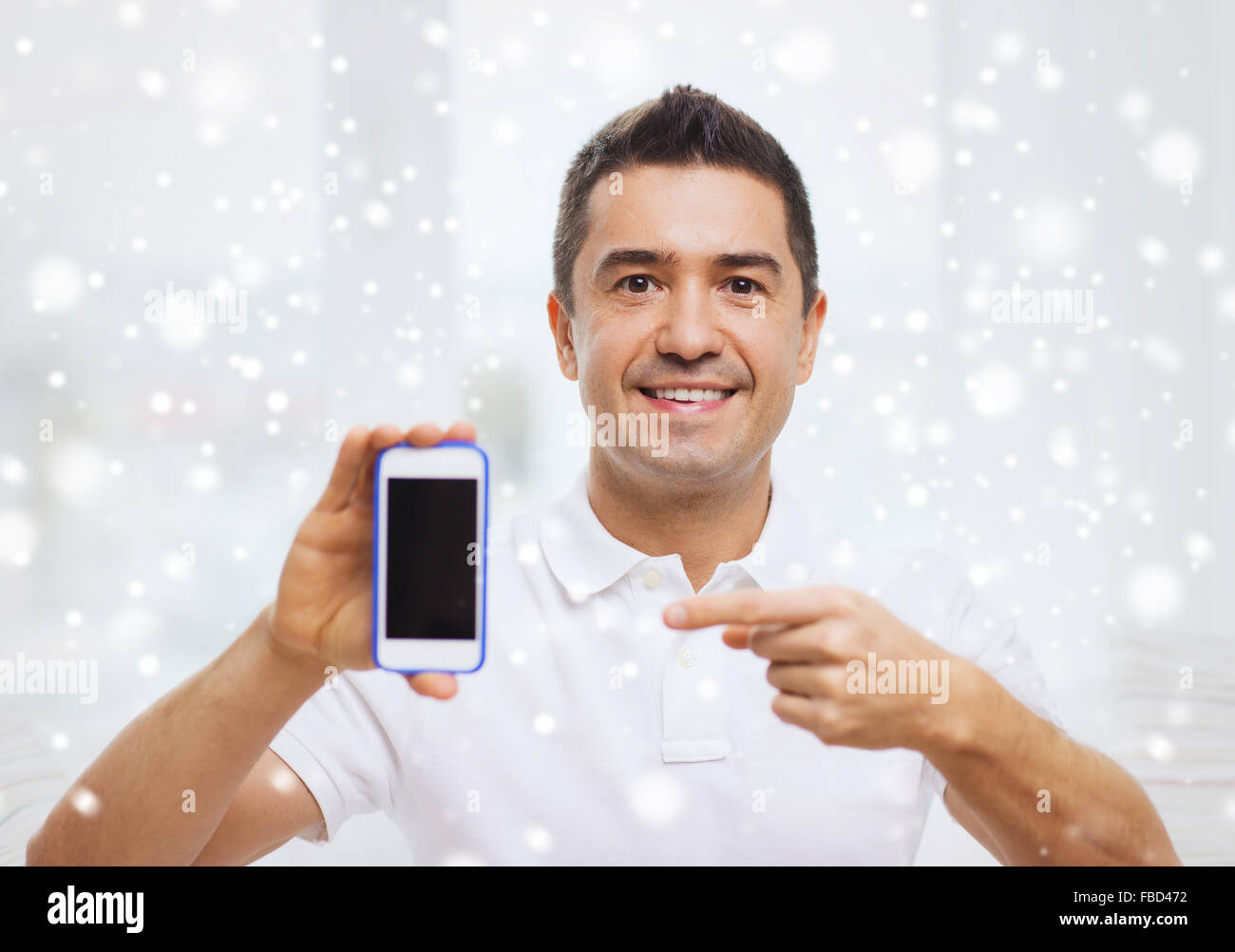 Cheerful businessman pointing smartphone hi-res stock photography and ...