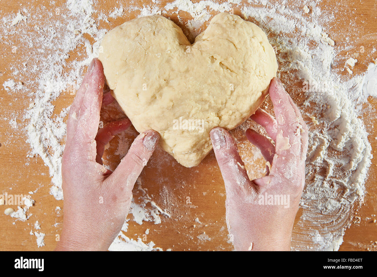 Woman cooking dough cake hi-res stock photography and images - Alamy