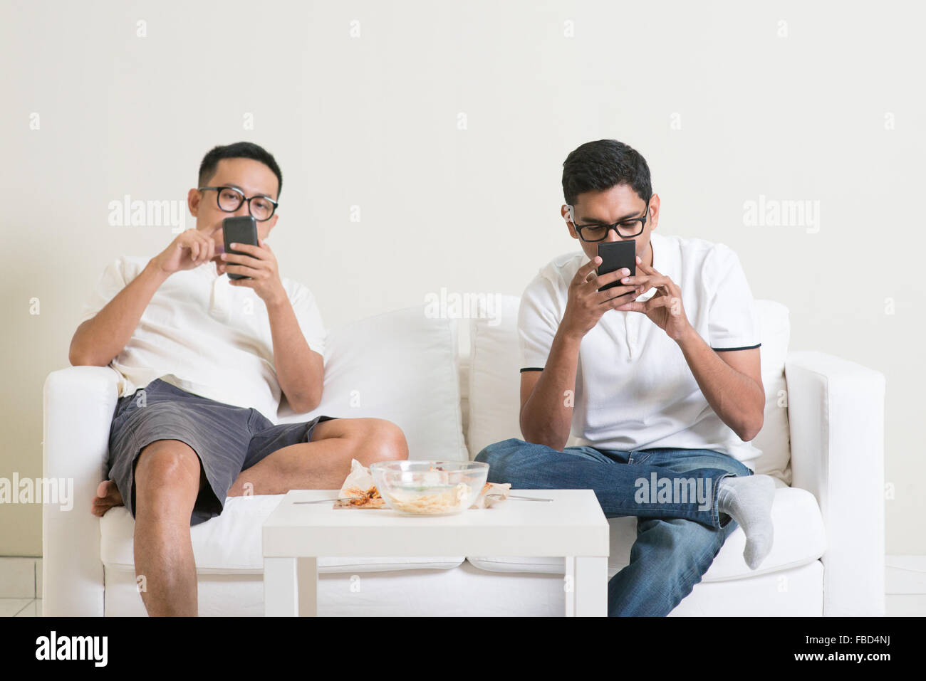 Playing app games on smartphones hi-res stock photography and images ...