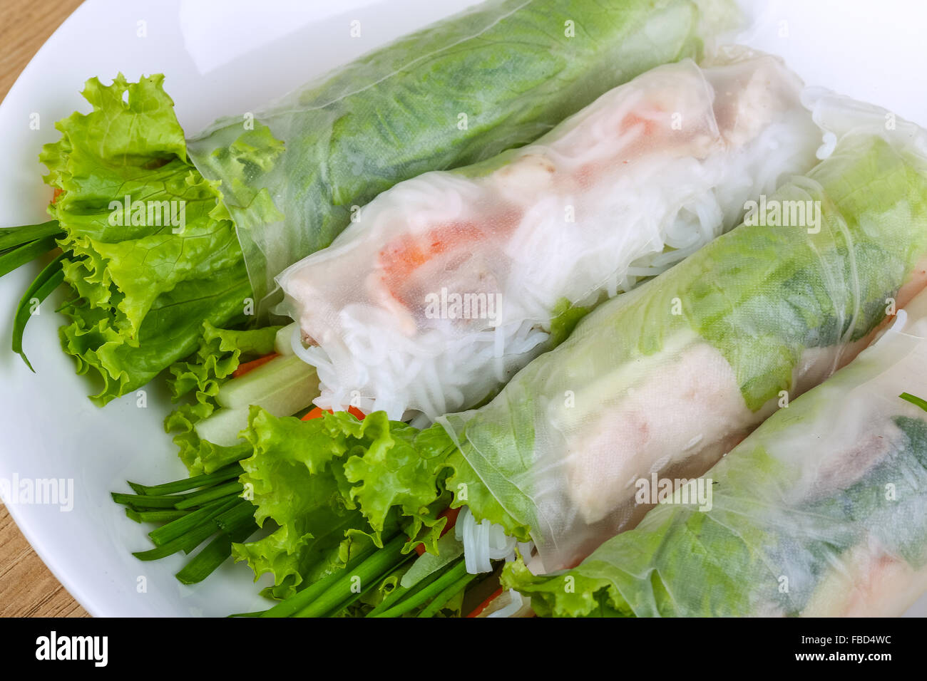 Asian traditional spring rolls on the wood background Stock Photo - Alamy
