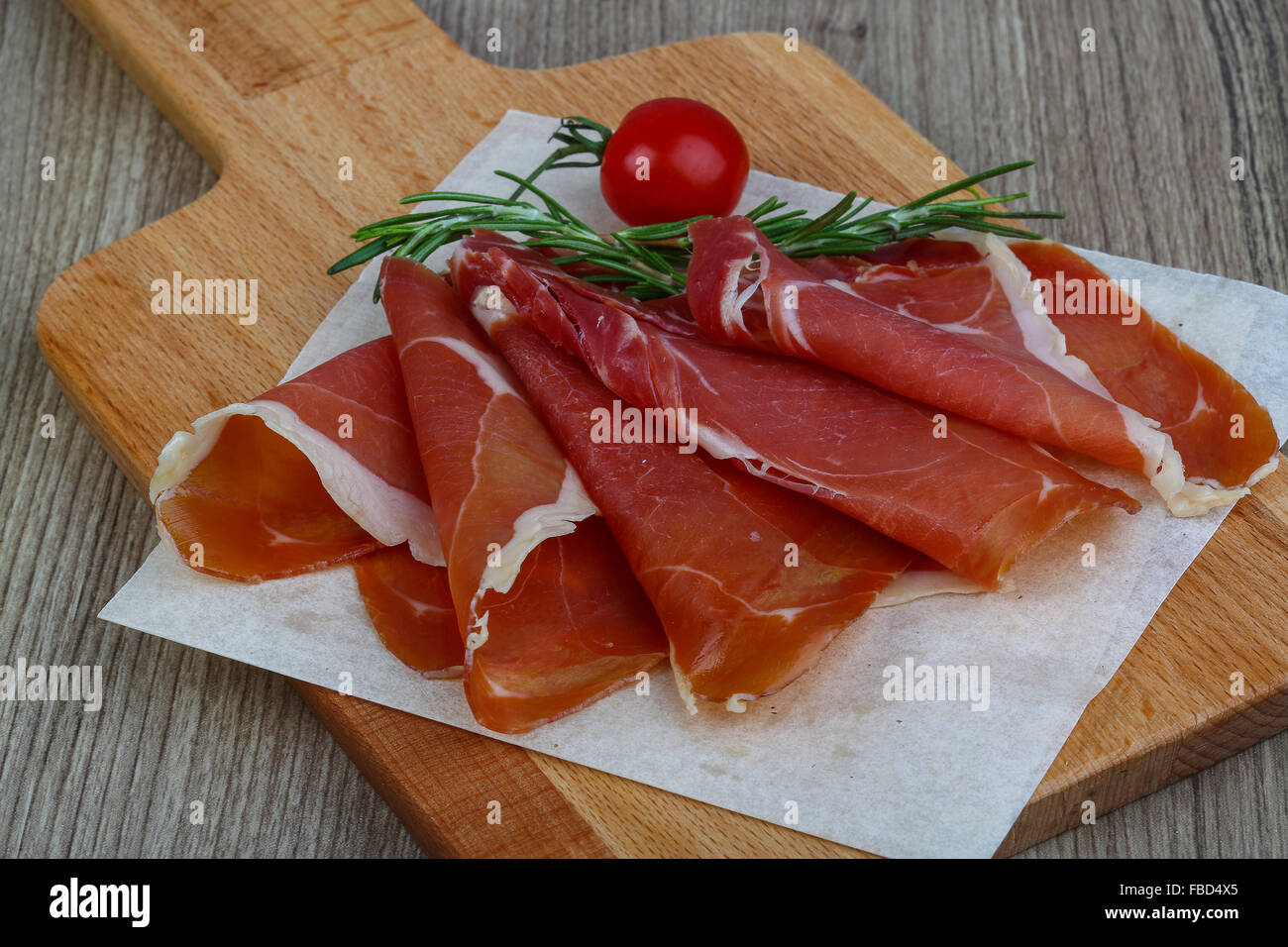 Spanish traditional snack - Jamon with tomato and rosemary Stock Photo ...