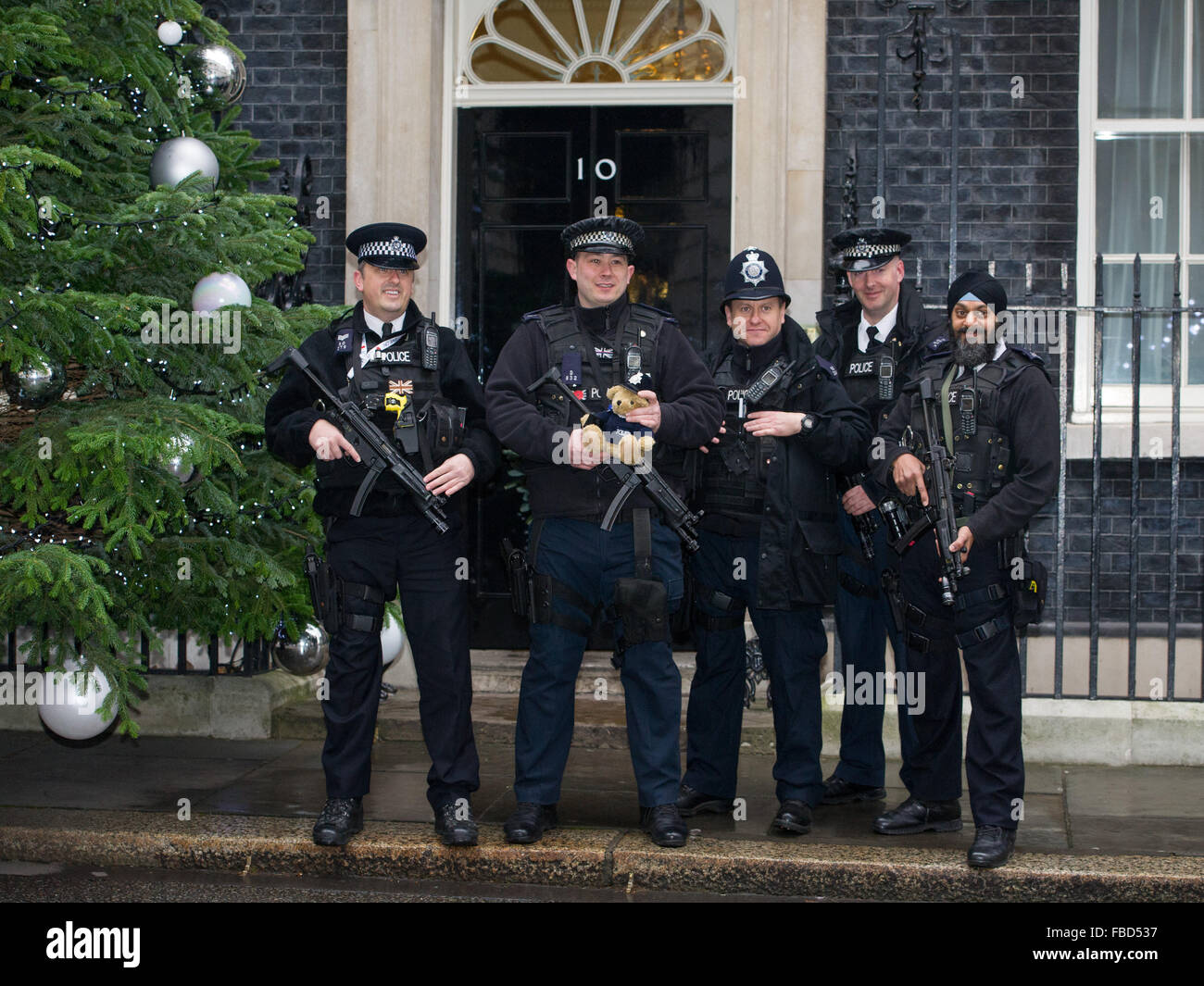 Armed police pose with 'Bobby the Bear' at Number 10 Downing Street ...