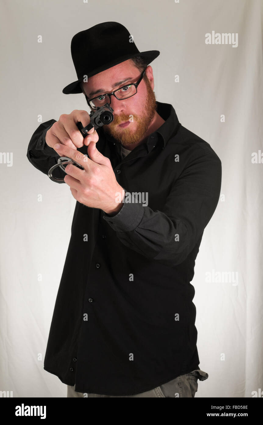 Man Holding a Pistol Gun Stock Photo - Alamy