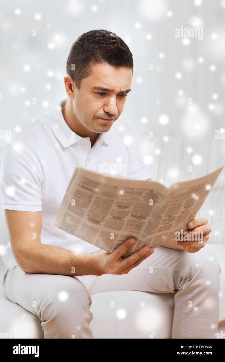 sad man reading newspaper at home Stock Photo - Alamy