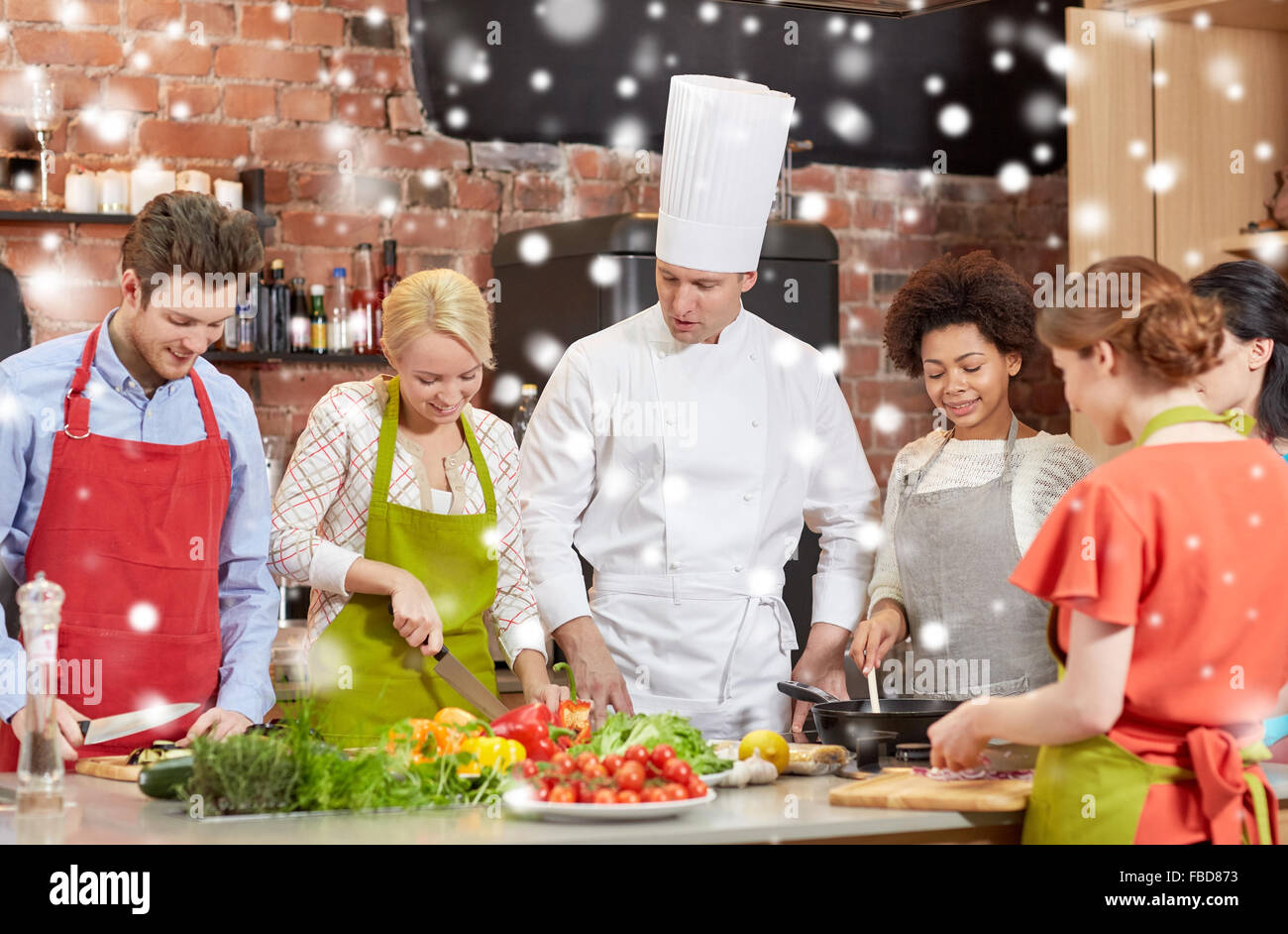 happy friends and chef cook cooking in kitchen Stock Photo - Alamy