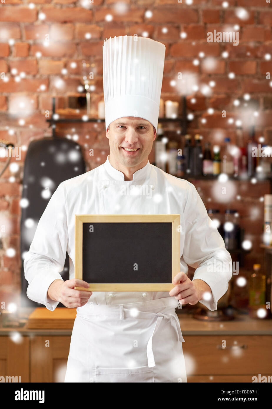 happy male chef with blank menu board in kitchen Stock Photo - Alamy