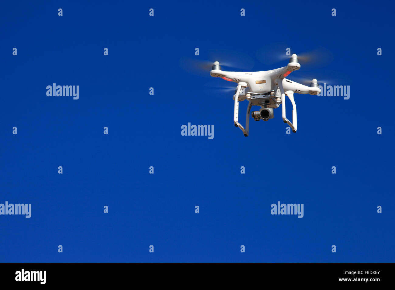 White drone equipped with high resolution 4K video camera Stock Photo ...
