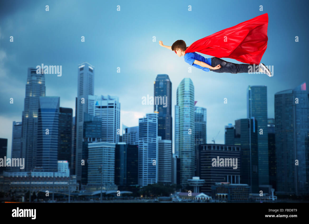 boy in red superhero cape and mask flying on air Stock Photo - Alamy