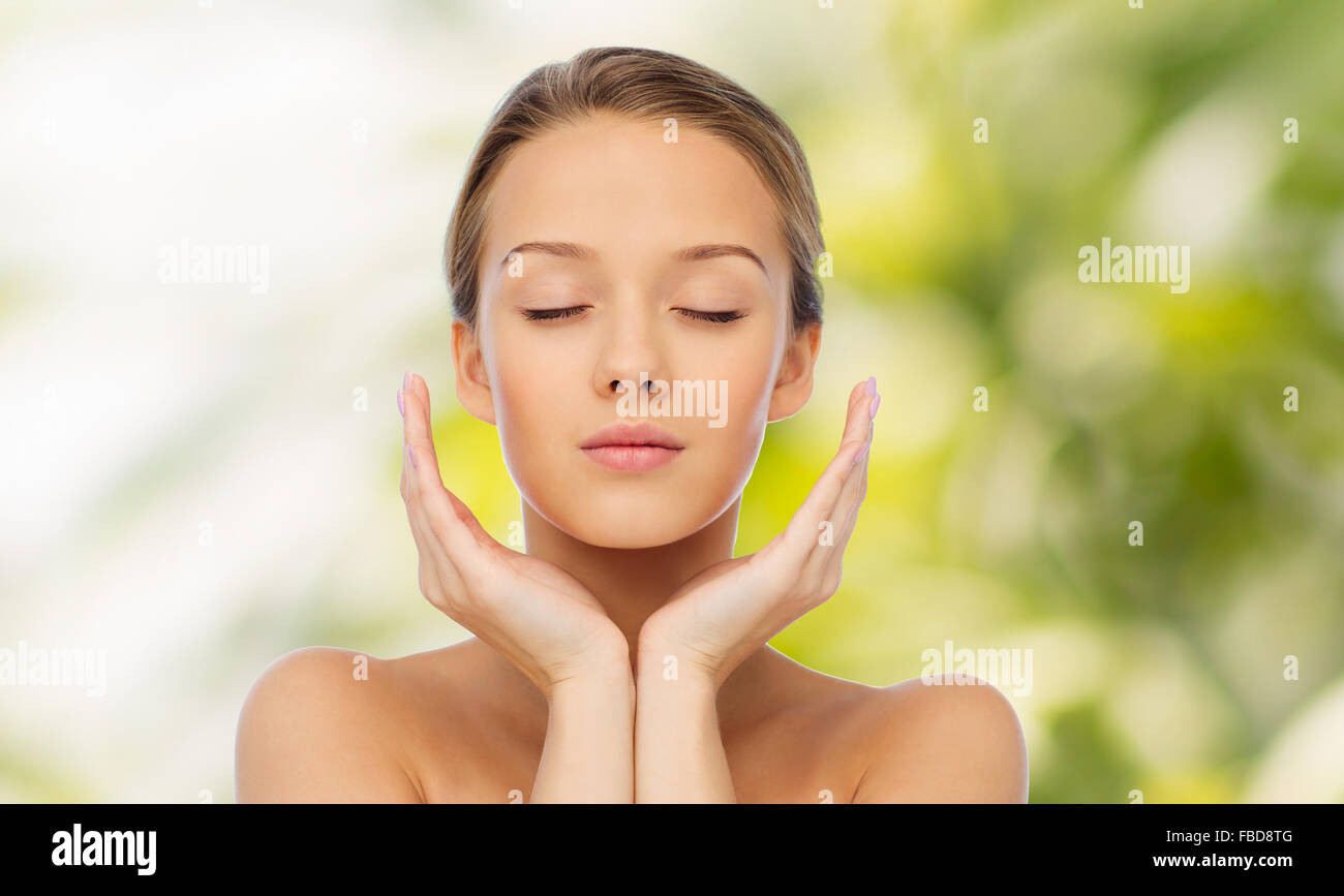 young woman face and hands Stock Photo - Alamy