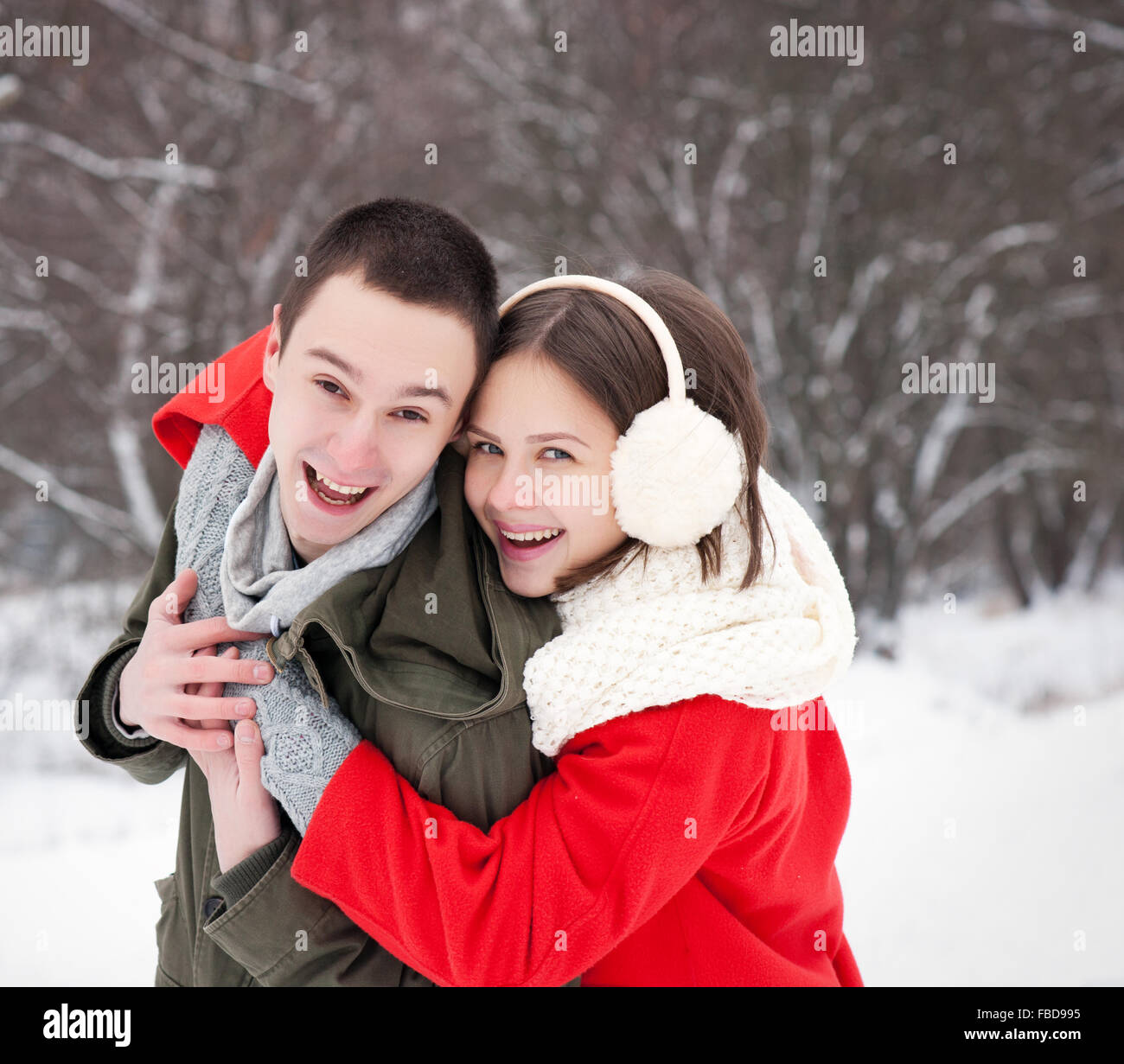 Couple smiling with perfect teeth hugging and looking at camera in ...