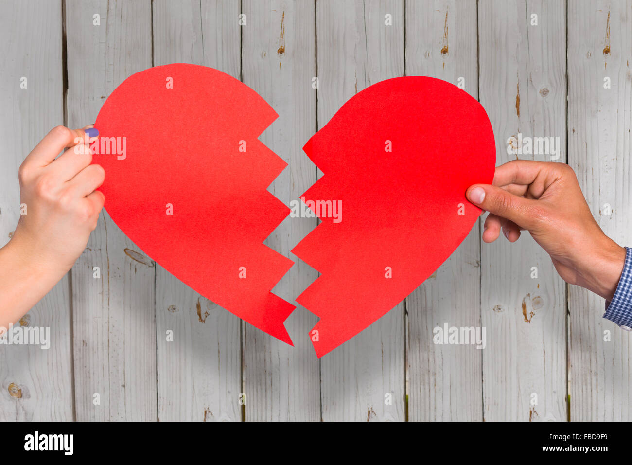 Hands holding broken heart hi-res stock photography and images - Alamy