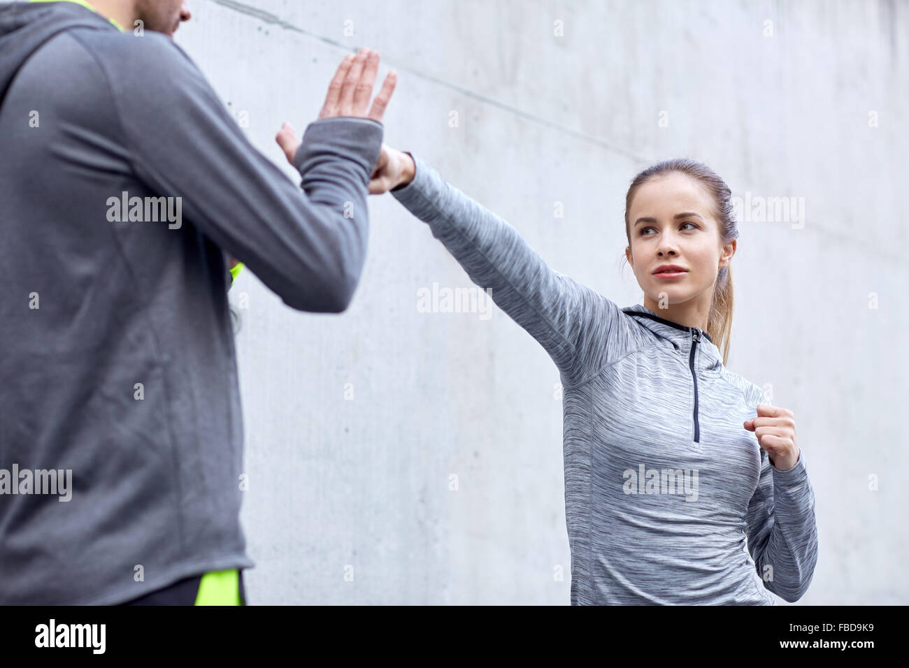 woman with coach working out strike outdoors Stock Photo - Alamy