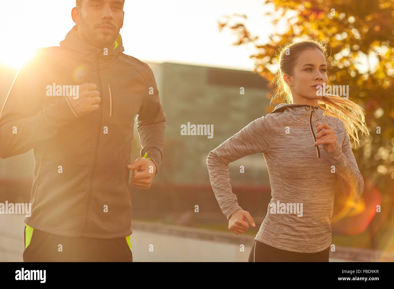 couple running outdoors Stock Photo - Alamy