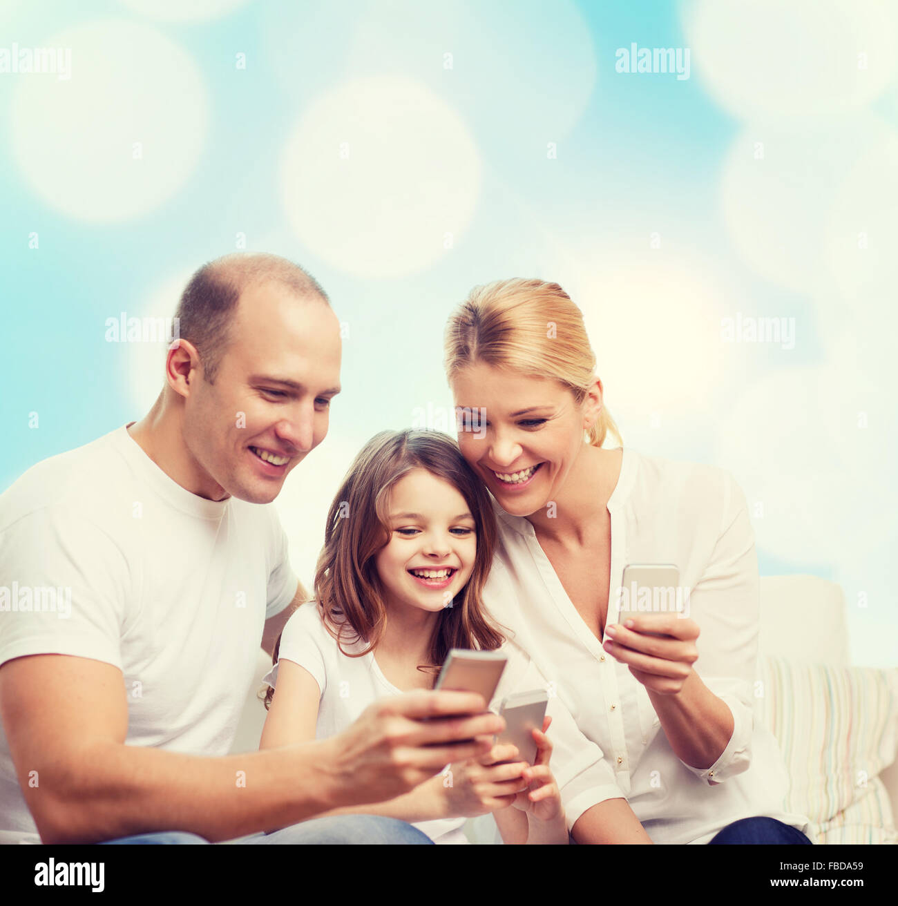 happy family with smartphones Stock Photo - Alamy