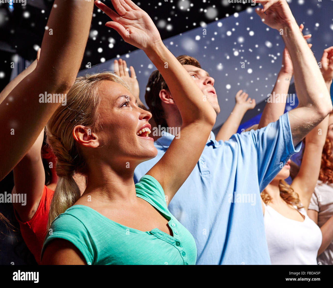 smiling friends at concert in club Stock Photo - Alamy