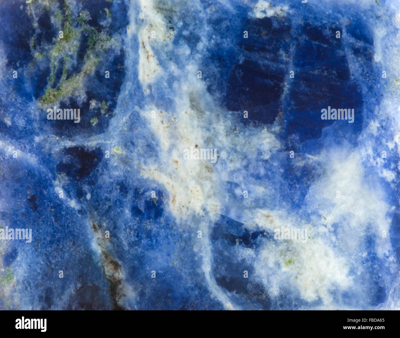 blue and whte background from surface of Sodalite natural mineral gem ...