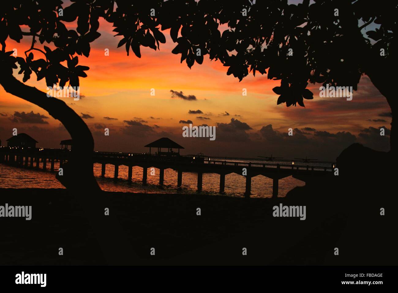 Long Silhouette Jetty Over Calm Sea Stock Photo - Alamy