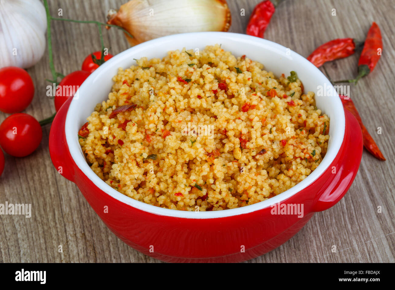 Arabic traditional cuisine - Couscous with tomato and green onion Stock ...