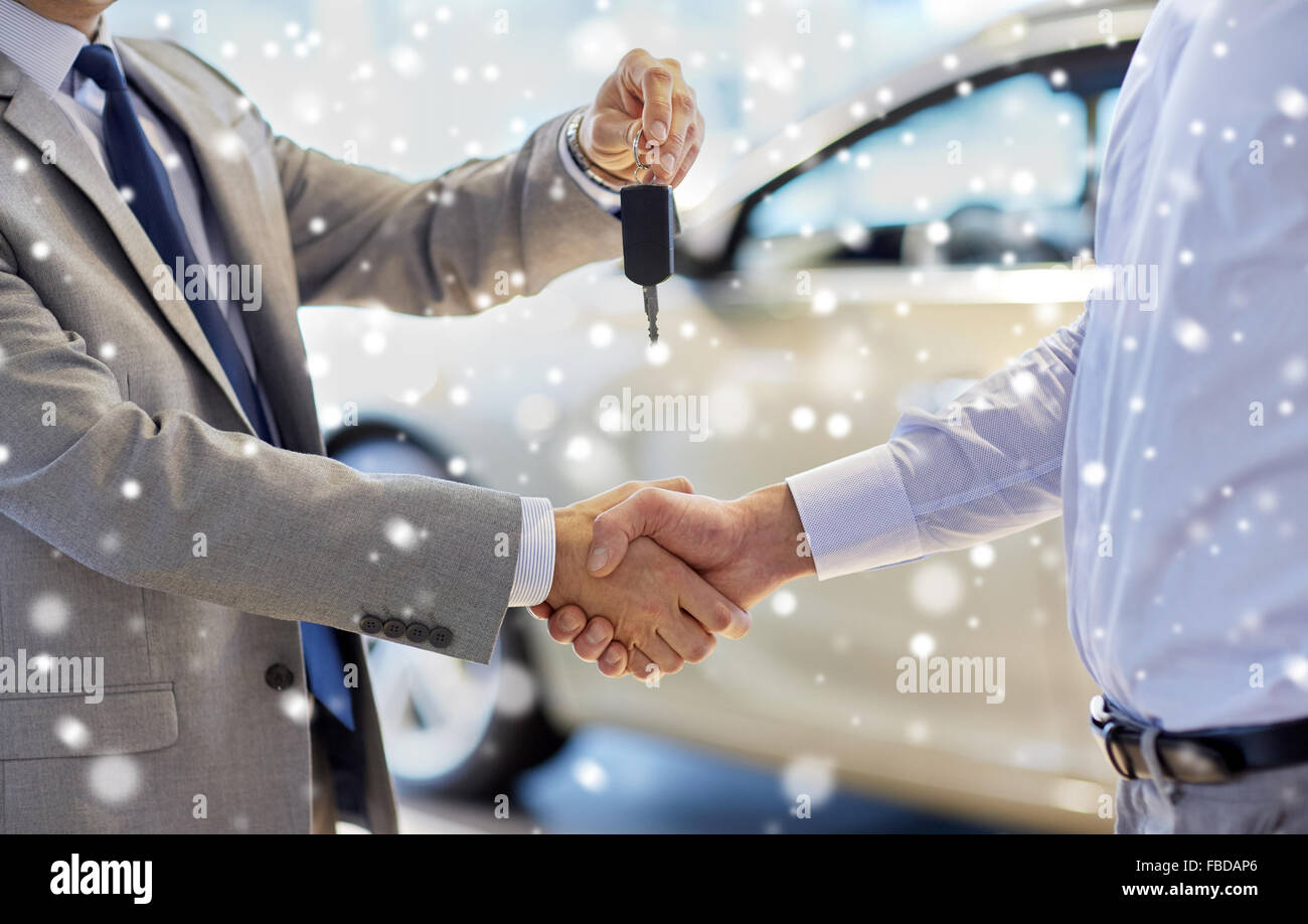 close up of handshake in auto show or salon Stock Photo - Alamy