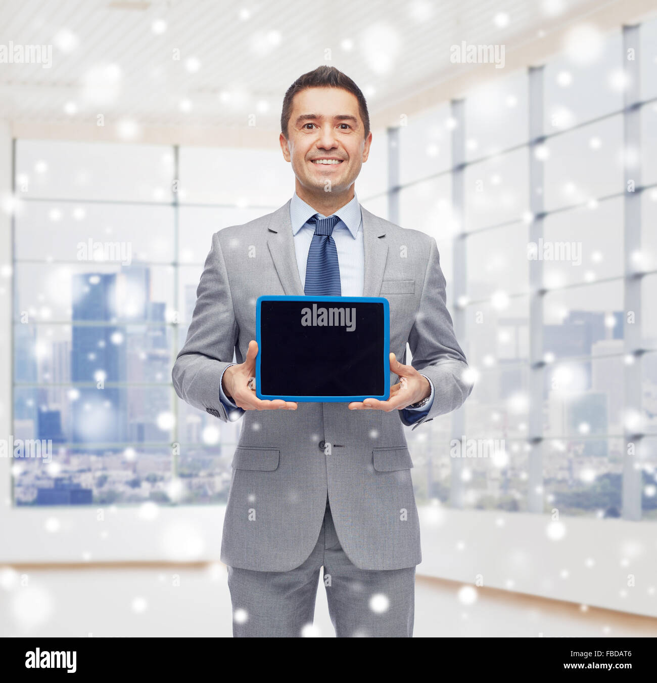 happy businessman in suit showing tablet pc screen Stock Photo - Alamy