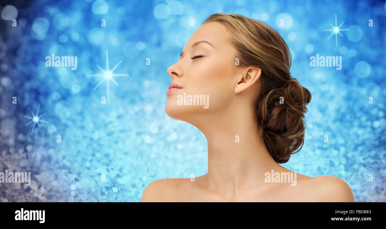 young woman face and shoulders over blue lights Stock Photo - Alamy