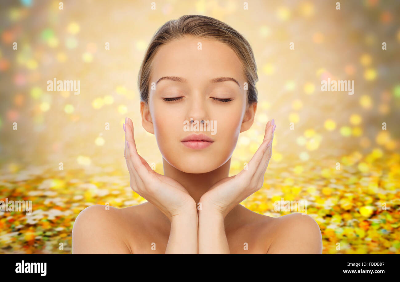 young woman face and hands Stock Photo - Alamy