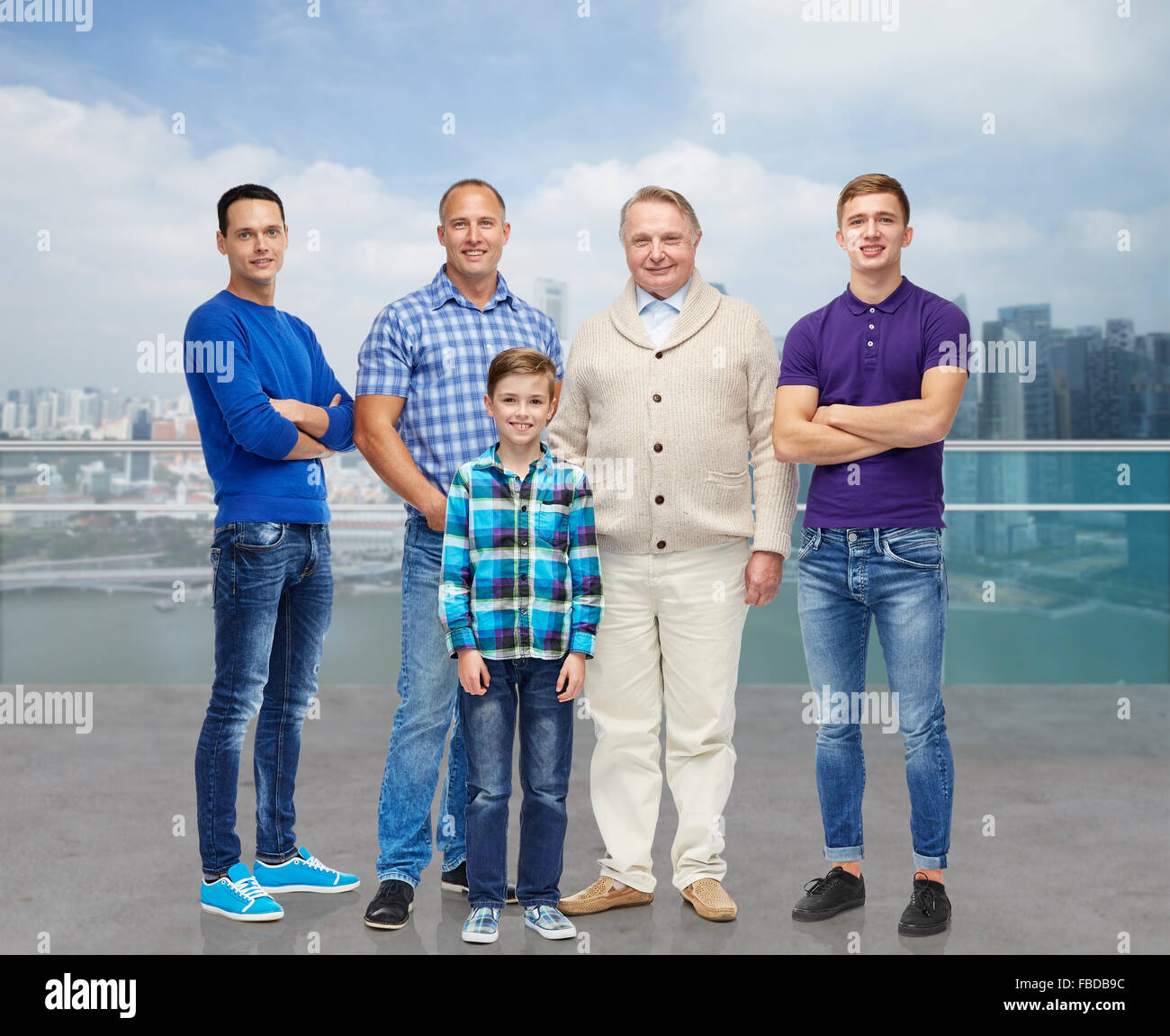 group of smiling men and boy Stock Photo - Alamy