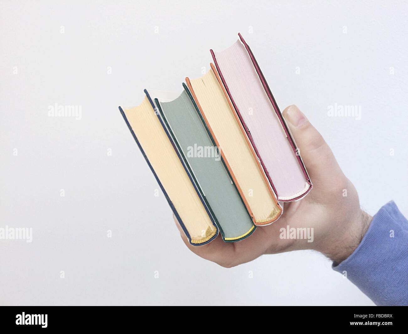 Books hand hi-res stock photography and images - Alamy
