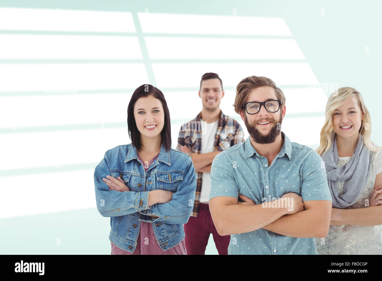 Composite image of portrait of smiling business professionals with arms ...